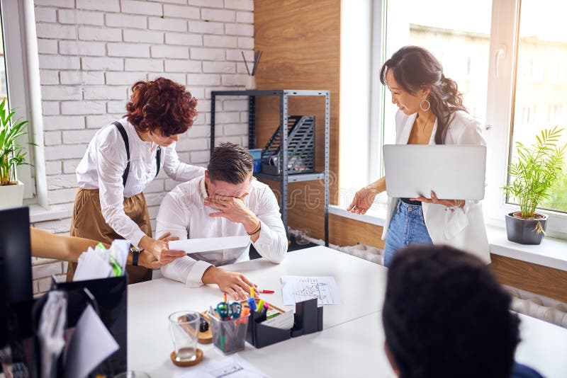 Tired Exhausted Man Surrounded by Co-workers Stock Image - Image of ...