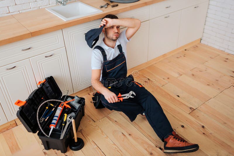 Tired Plumber with Neck Pain Stock Photo - Image of handyman, plumber ...