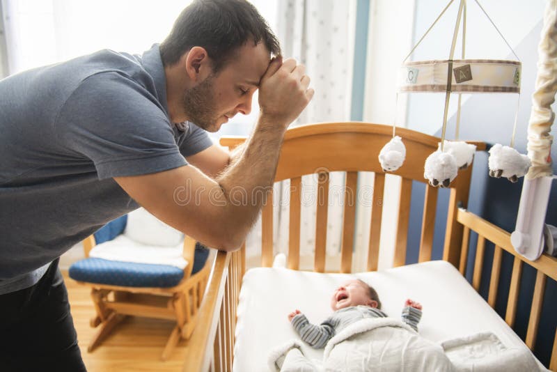 Tired Father with Upset Baby Suffering with Post Natal Depression ...