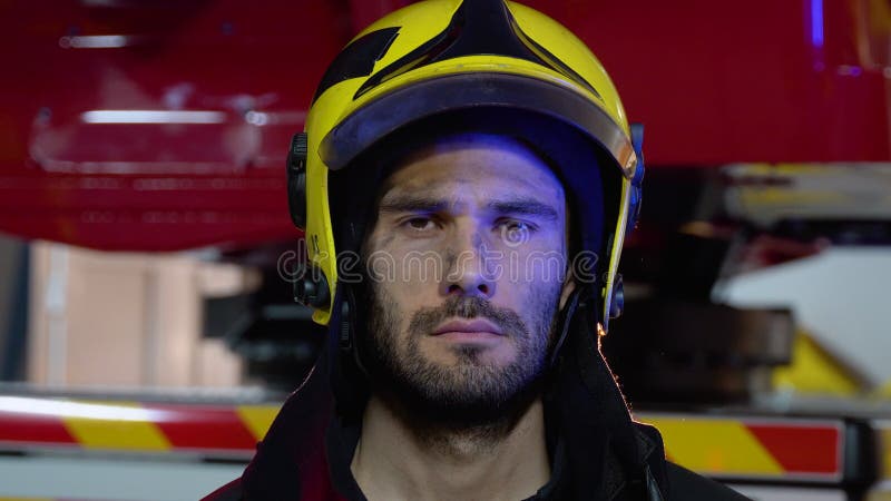 Tired Firefighter in Protective Uniform Looking at Camera Near Fire ...