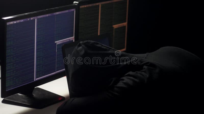 A Tired Hacker Working at a Computer in a Dark Room. he Laid His Head ...