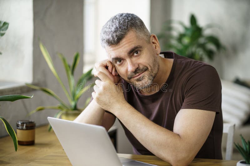 Tired but Happy Middle Aged Man Leaned on Hands Working Sitting at ...