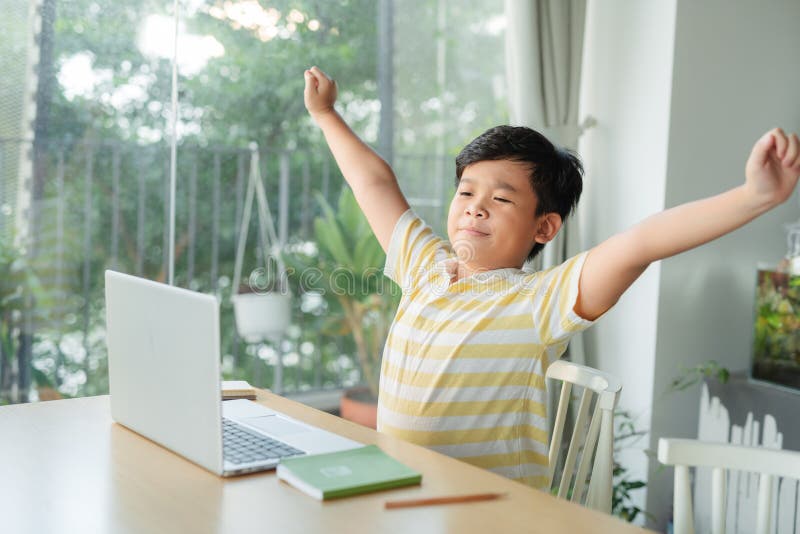 Tired Kid Finish Making Homework with Books, Notebooks and Digital ...