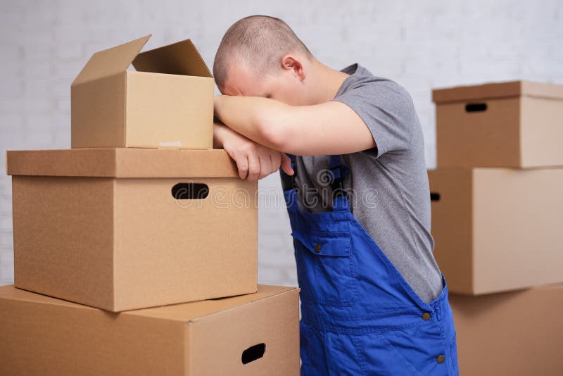Tired Loader Sleeping on Stack of Parcels Stock Image - Image of ...