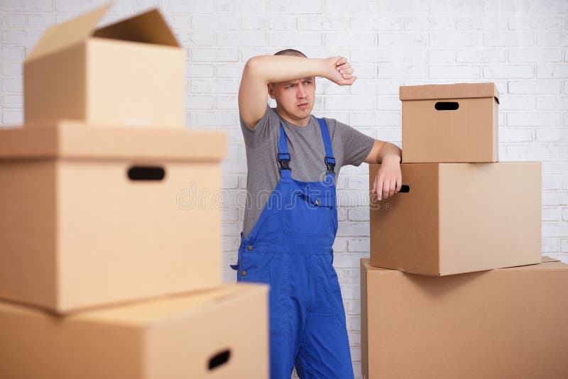 Tired Loader Man between Big Cardboard Boxes Stock Photo - Image of ...