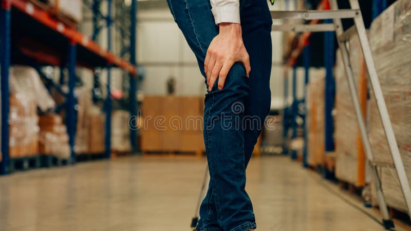Tired Male Warehouse Worker Suffering from Standing for Long Time at ... Tired Male Warehouse Worker Suffering from Standing for Long Time at ...