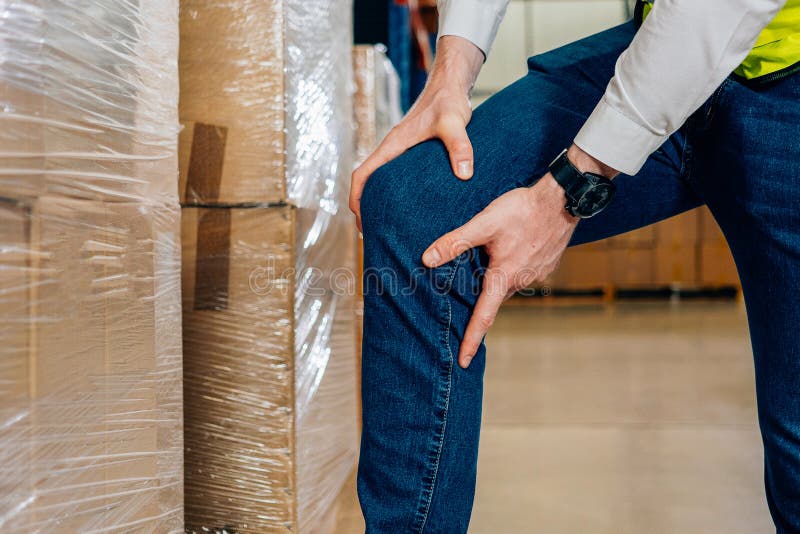 Tired Male Warehouse Worker Suffering from Standing for Long Time at ... Tired Male Warehouse Worker Suffering from Standing for Long Time at ...