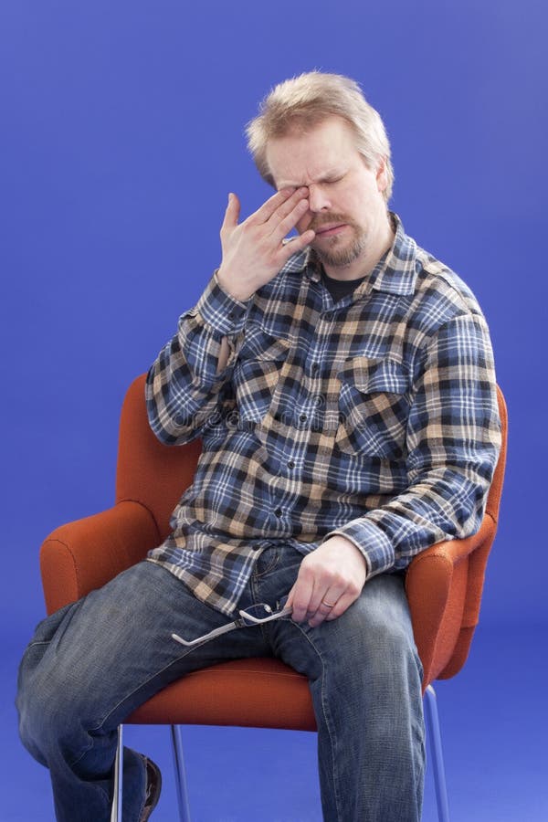 Tired Man Sitting On A Chair Stock Image - Image of stress, beard: 14026687