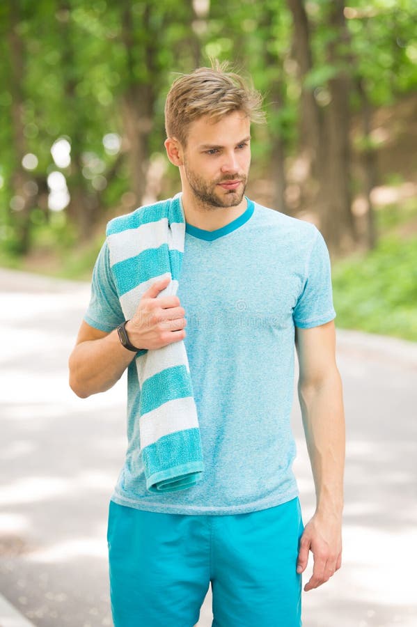 Tired Man. Tired Man with Towel Relax after Training in Forest. Man ...