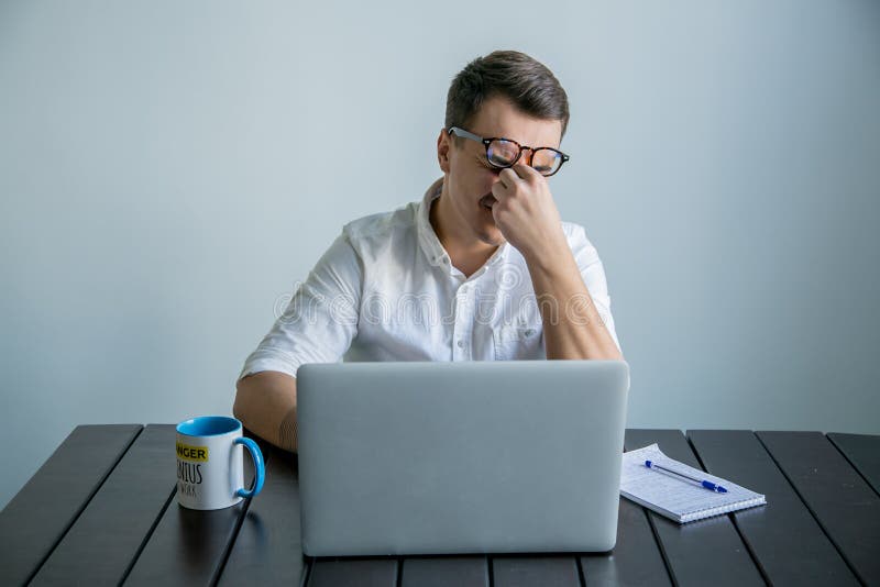 Tired Man Working in the Office Stock Image - Image of notebook ...