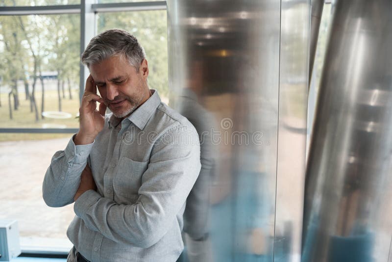 Tired Manager Stands at Large Window and Suffers from Pain Stock Image ...