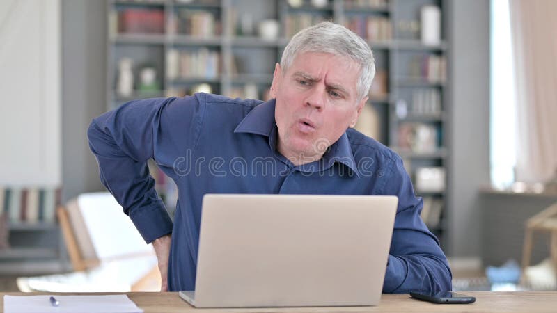Tired Middle Aged Man Having Back Pain while Working on Laptop Stock ...