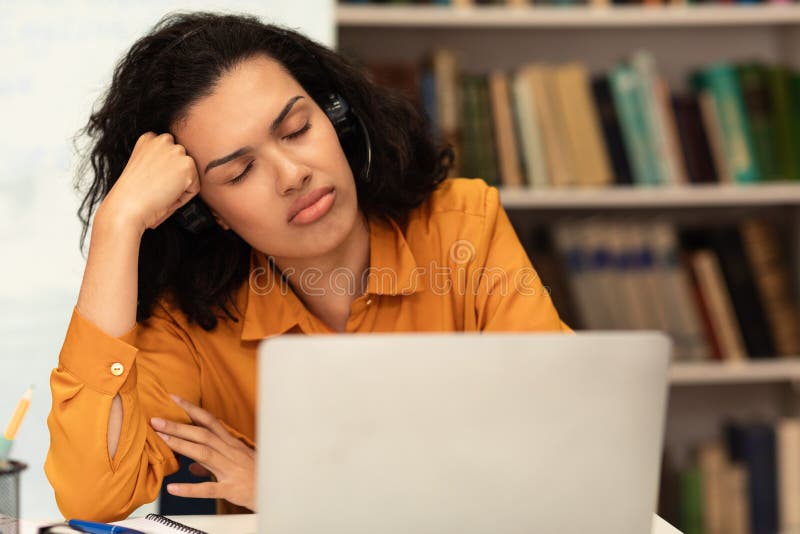 Tired Mixed Race Female Student Sleeping on Table in Front of Laptop ...