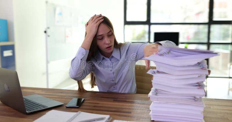 Tired Nervous Intern Working Hard with Documents in Office Stock ...
