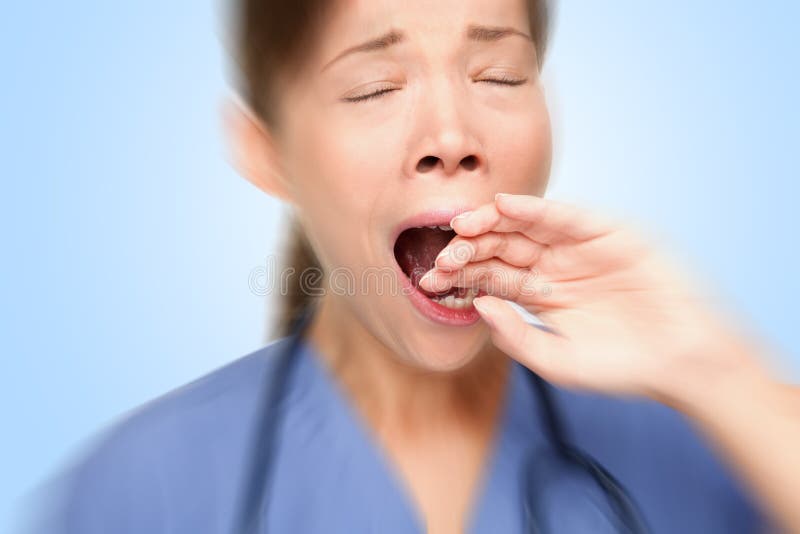 Tired nurse yawn at work stock photo. Image of exhausted - 17615058