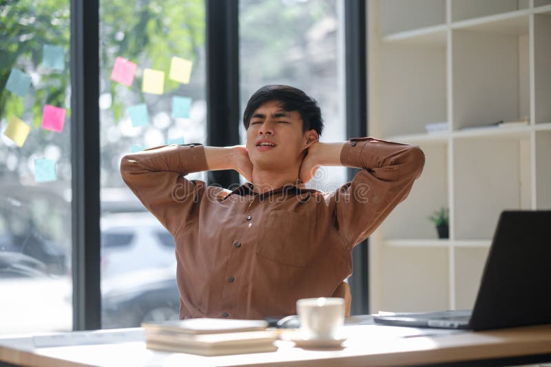 Tired Office Worker Experiencing Neck and Shoulder Pain from Prolonged ...