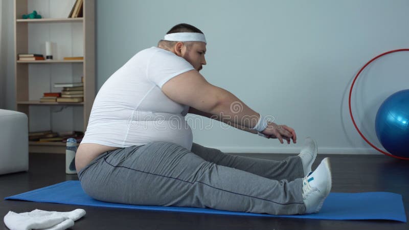 Tired Overweight Man Stretching and Falling Down Mat after Exhausting ...
