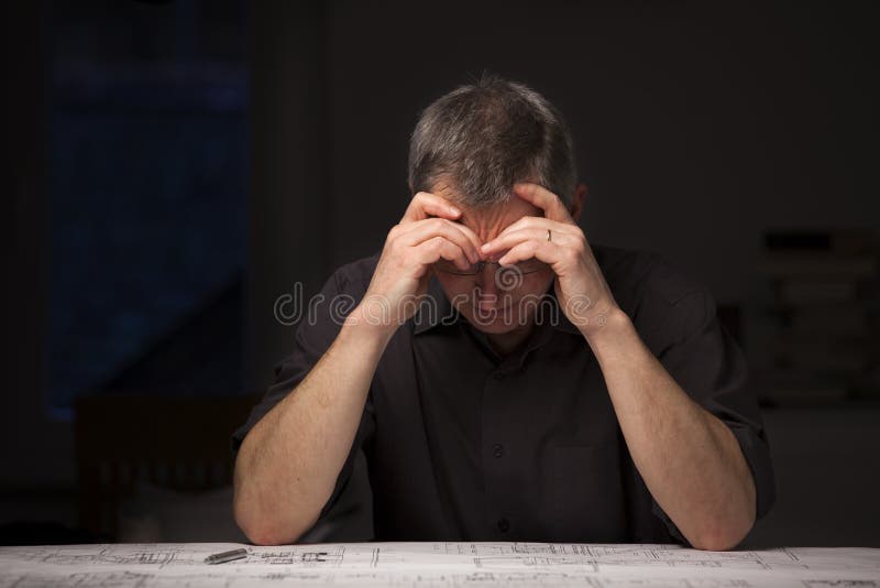 Tired and Overworked Architect or Engineer Sitting at Home at a Desk ...