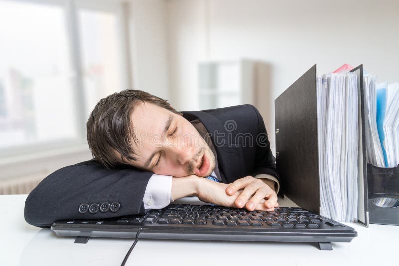 Tired Overworked Man is Sleeping on Keyboard in Office at Work Stock ...
