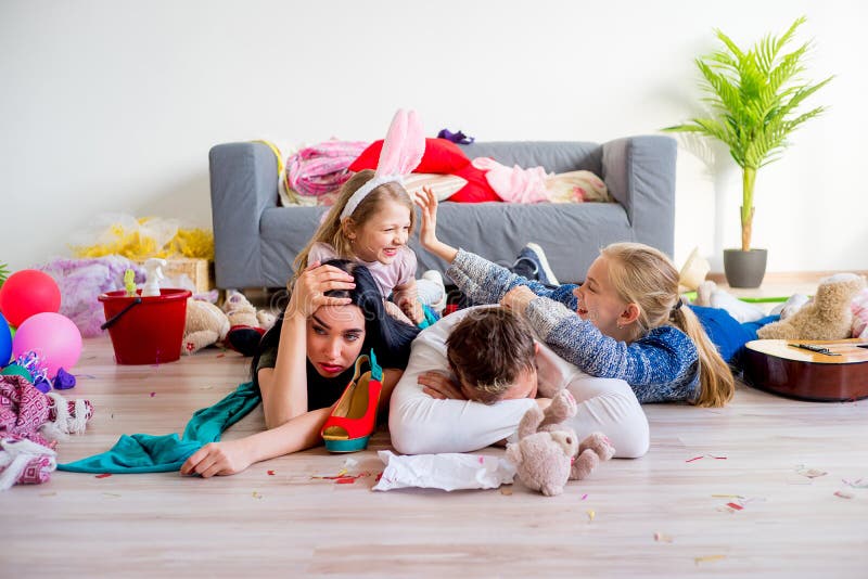 Tired Parents and Romping Kids Stock Image - Image of indoor, mess ...