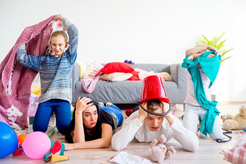 Tired Parents and Romping Kids Stock Photo - Image of home, housekeeper ...