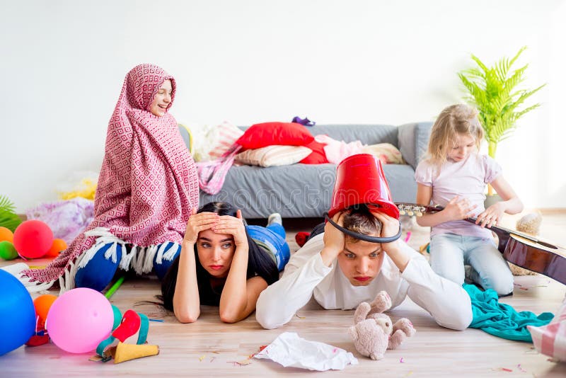 Tired Parents and Romping Kids Stock Photo - Image of stress, romp ...