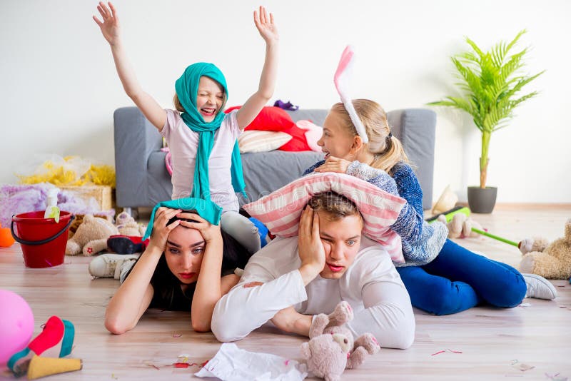Tired Parents and Romping Kids Stock Photo - Image of fooling, home ...