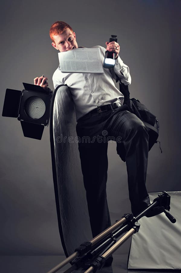 A Tired Photographer Assistant Stock Image - Image of cheerful, indoors ...