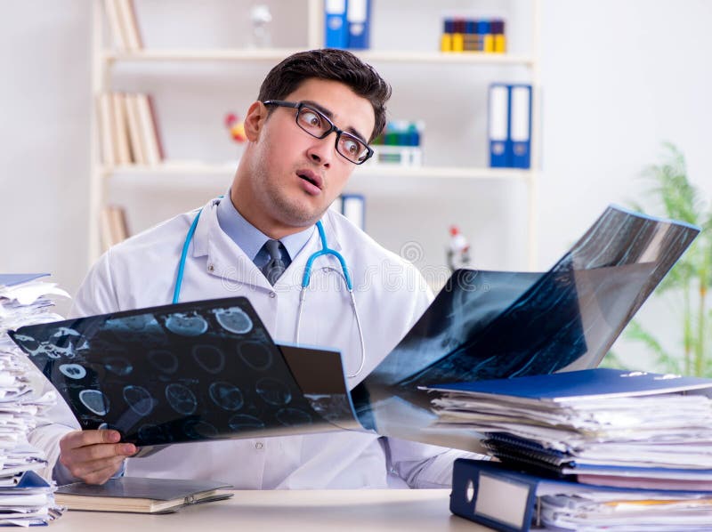 Tired Radiologist with X-ray Image in Hospital Stock Image - Image of ...