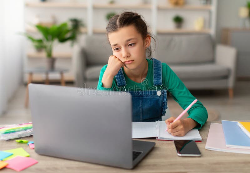 Tired School Girl Writing in Notebook Doing Homework Stock Image ...