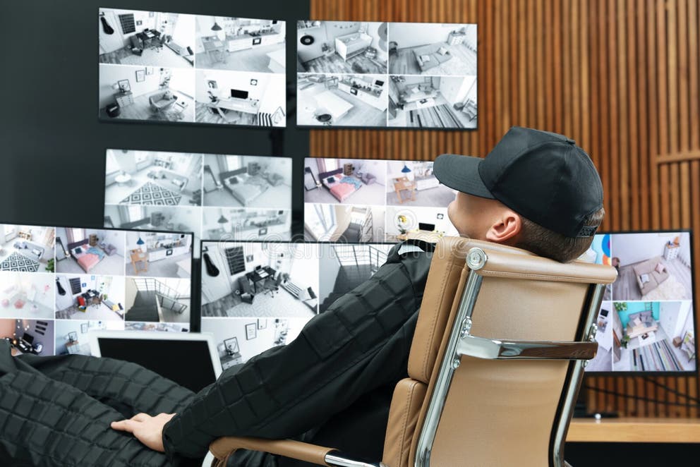 Tired Security Guard Sleeping at Workplace in Office Stock Photo ...