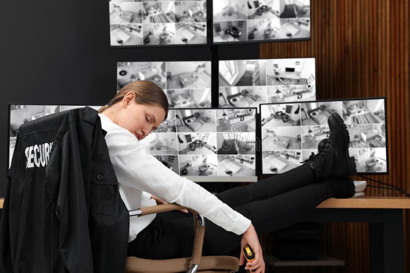 Tired Security Guard Sleeping at Workplace in Office Stock Photo ...