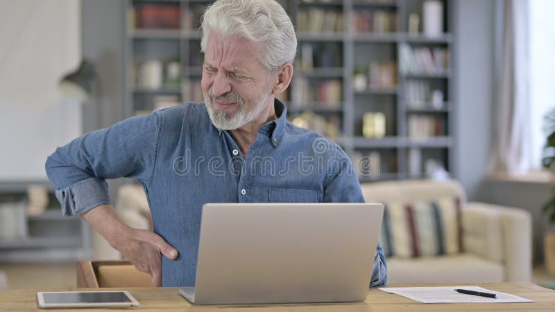 Senior Old Man Having Back Pain while Using Laptop in Office Stock ...