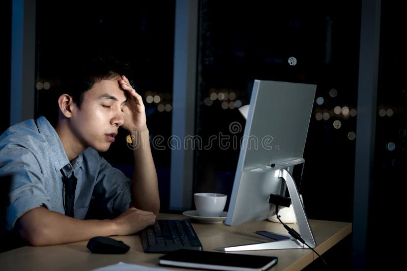 Tired Staff Officer Put Head on Hands during Work with Desktop Computer ...