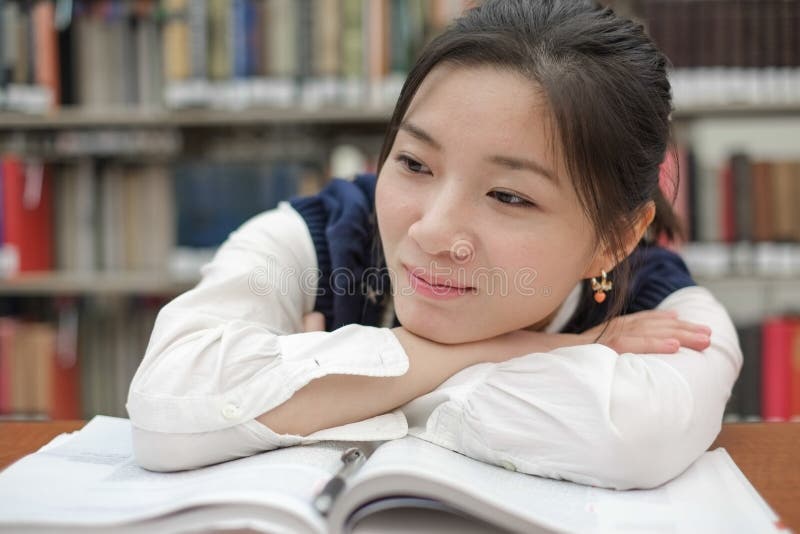 Tired Student Doing Homework in Library Stock Photo - Image of modern ...