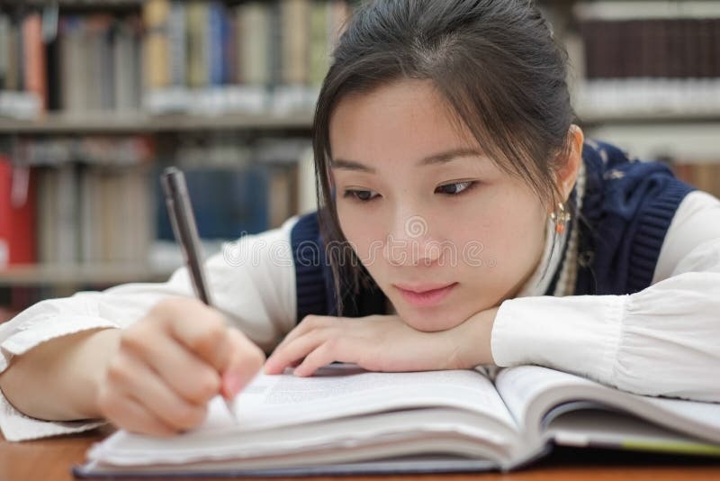 Tired Student Doing Homework in Library Stock Photo - Image of enjoy ...