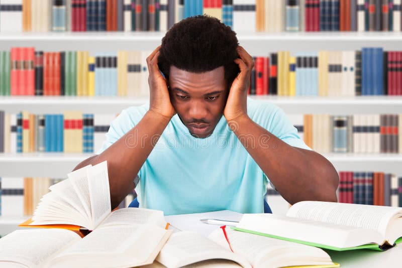 Tired student in library stock image. Image of lifestyle - 51626135
