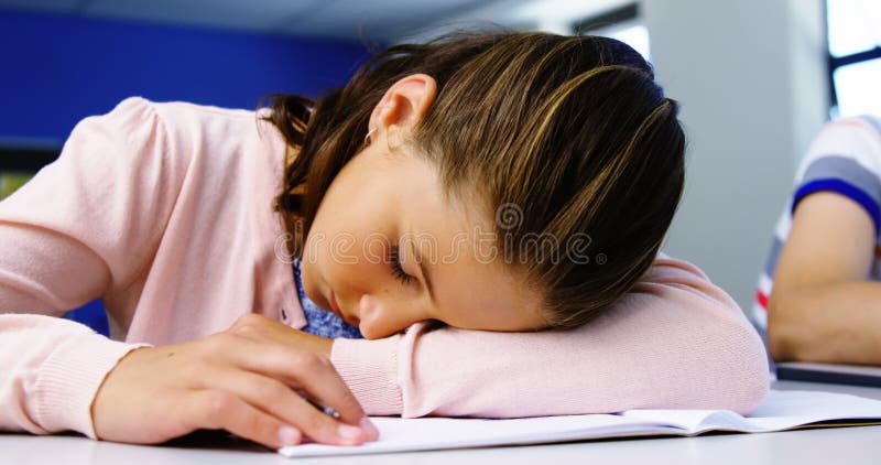 Tired Student Girl Sleeping on the Books in the School Library ...