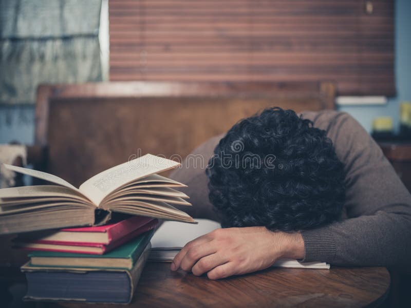 Tired Student Surrounded by Books Stock Photo - Image of research ...