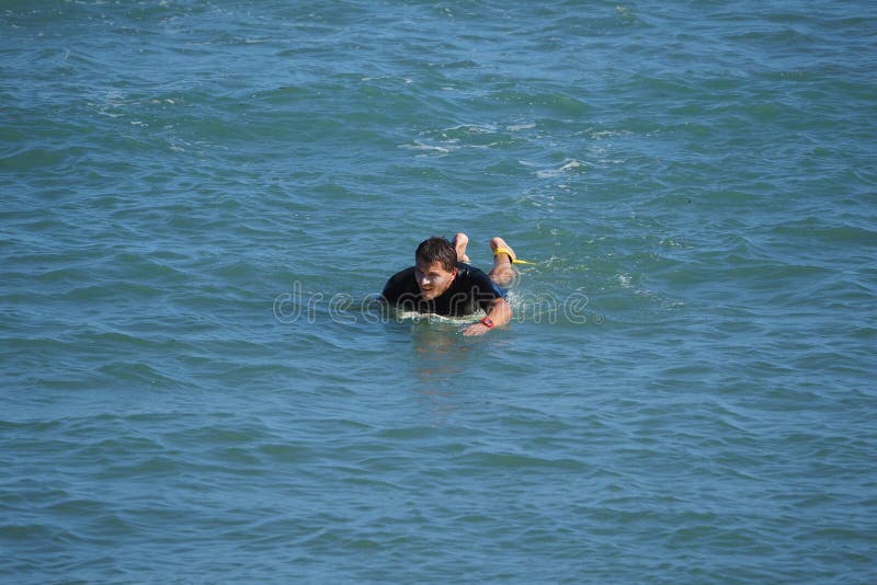 Tired Surfer Floats Out of the Water. Stock Image - Image of away, male ...