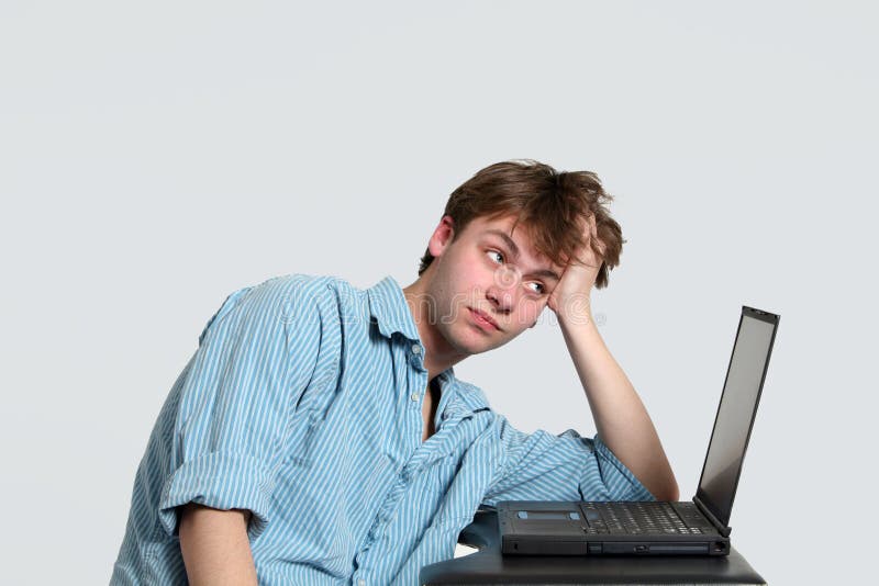 Tired teen boy at computer stock photo. Image of computer - 8856190