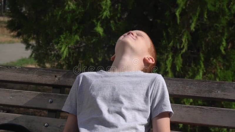 Tired Child Resting on a Bench Stock Footage - Video of lifestyle, face ...