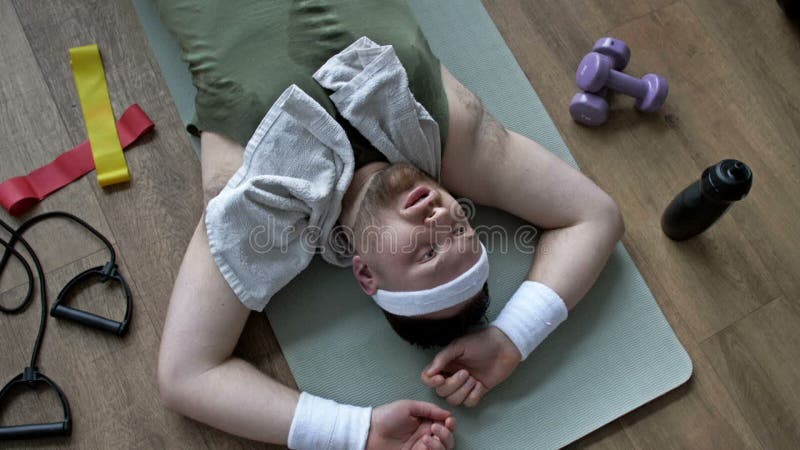 Tired of Training, a Man in Exhaustion Falls on a Karemat. Stock Video ...