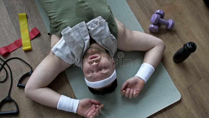 Tired of Training, a Man in Exhaustion Falls on a Karemat. Stock Video ...