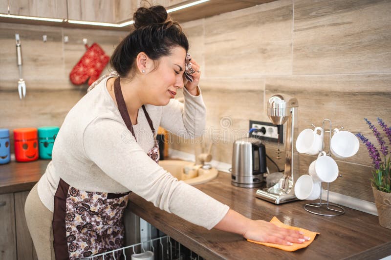 Tired Woman in Apron Cleaning Kitchen Counter Stock Image - Image of ...