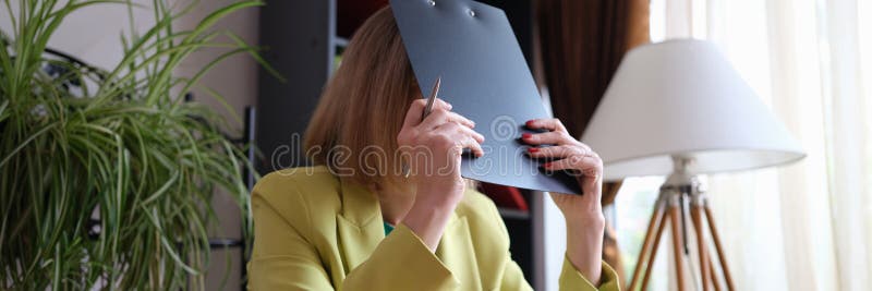 Tired Woman Covers Face with Folder of Documents Stock Image - Image of ...