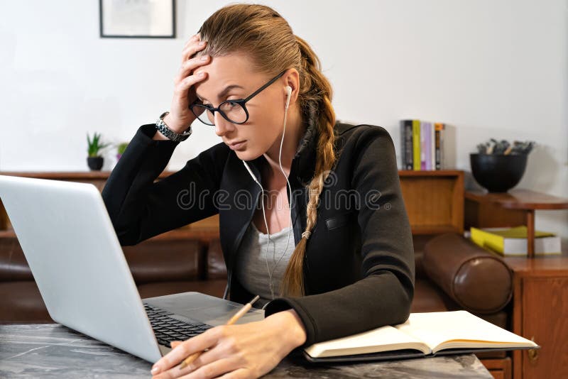 Young Woman with Eyeglasses, Headphones, Laptop Studying Working Online ...