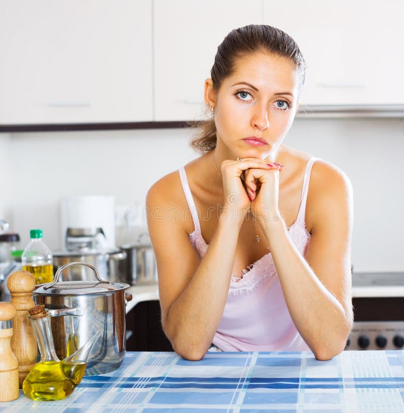 Tired woman at the kitchen stock photo. Image of casual - 57277902