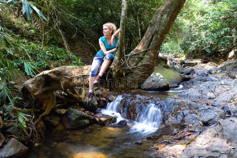 Tired Woman Sits on a Tree Trunk. Stock Image - Image of travel, nature ...