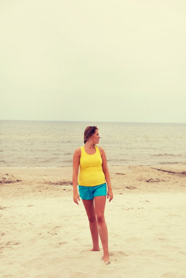 Tired Woman Standing on the Beach Stock Photo - Image of beach ...